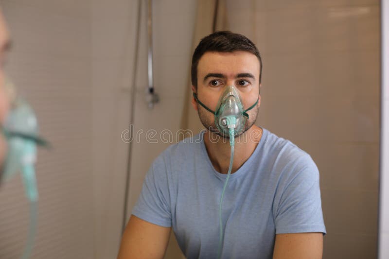 Man using a breathing aid stock image. Image of machine - 301296207