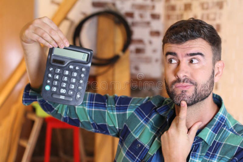 Man Using Calculator during Home Renovations Stock Image - Image of ...