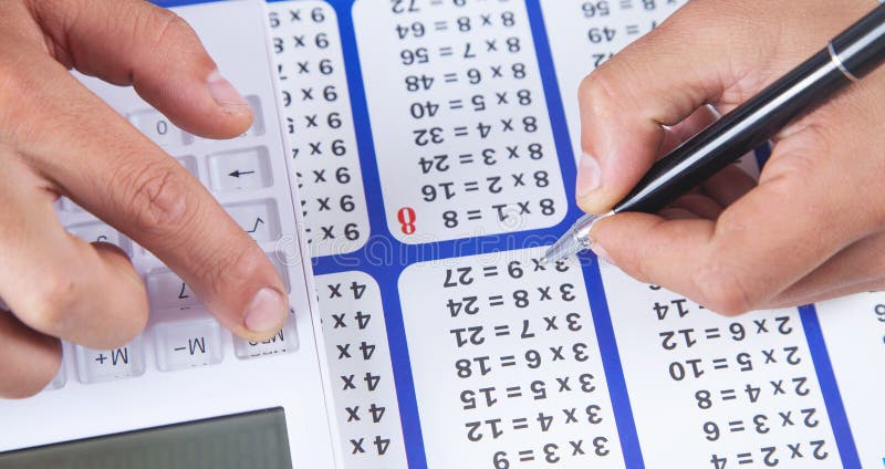 Man Using Calculator and Working in Multiplication Table Stock Photo ...