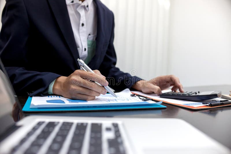 Man Using Calculator and Writing Make Note with Calculate Stock Photo ...