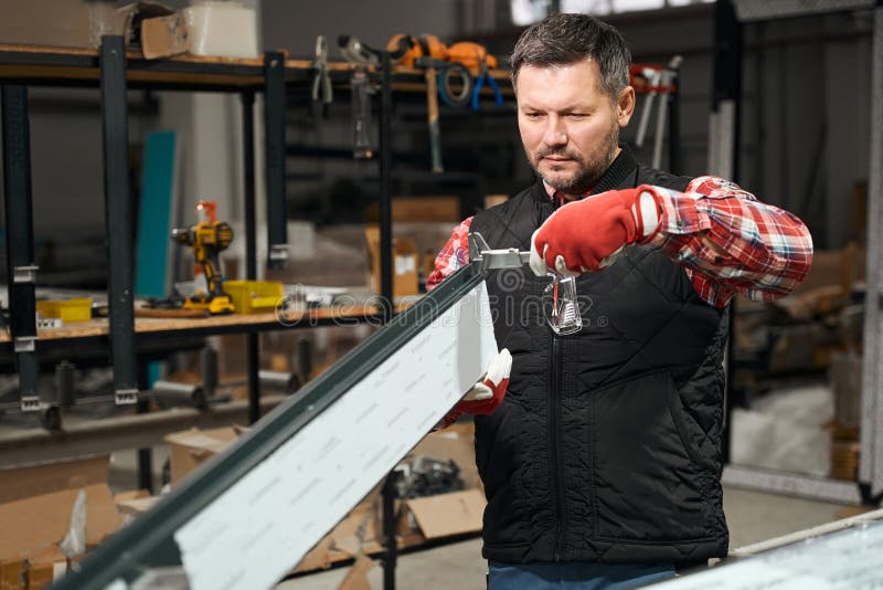Man Using Caliper To Working in the Steel Structure Warehouse Stock ...