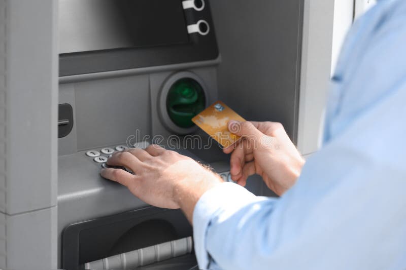 Man Using Cash Machine for Money Withdrawal Outdoors Stock Photo ...