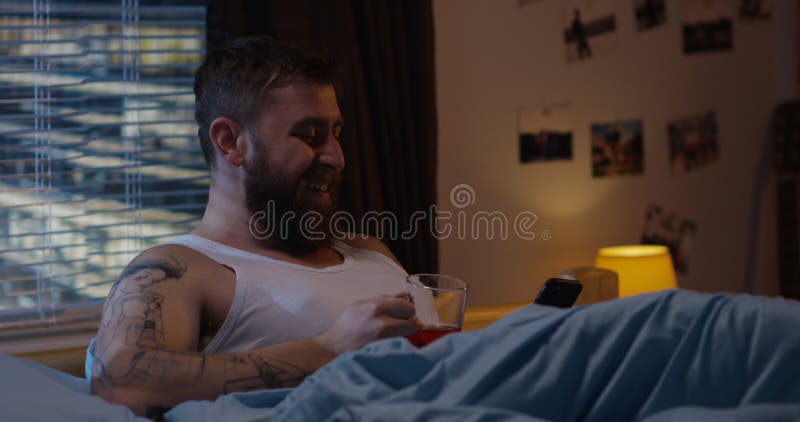 Man Using Cell Phone in Bed Stock Image - Image of caucasian ...