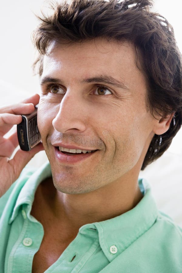 Man Using Cellular Phone and Smiling Stock Photo - Image of cell ...