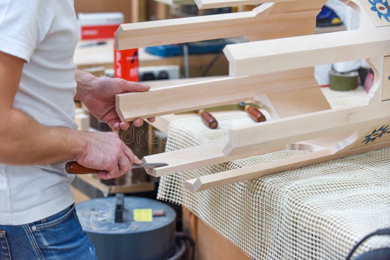 Man is Using a Chisel To Shape and Carve Wood in Carpentry Stock Photo ...