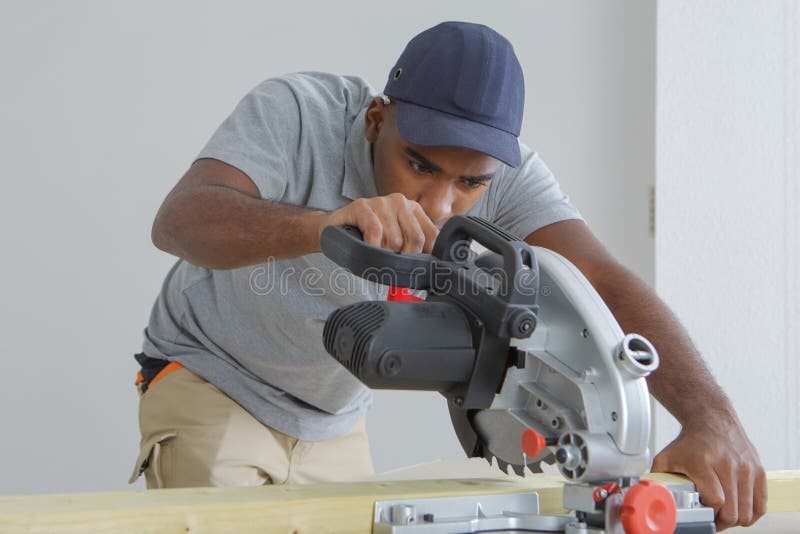 Man using circular saw stock image. Image of professional - 188227229