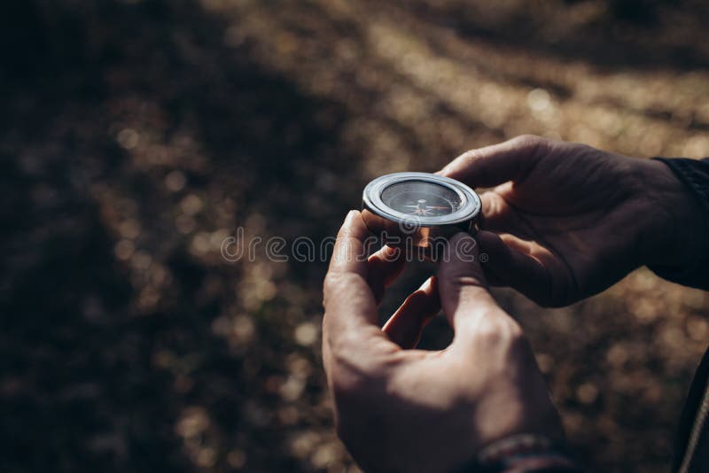 Man Using Compass in Forest Stock Photo - Image of adventure, direction ...