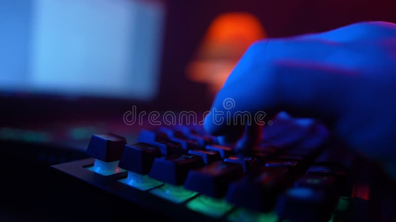 Man Using Computer Keyboard Code Website in Neon Lighting. Hacker and Cybercrime Stock Video ...