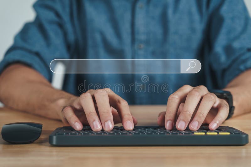 Man Using a Computer Keyboard To Searching for Information with the ...