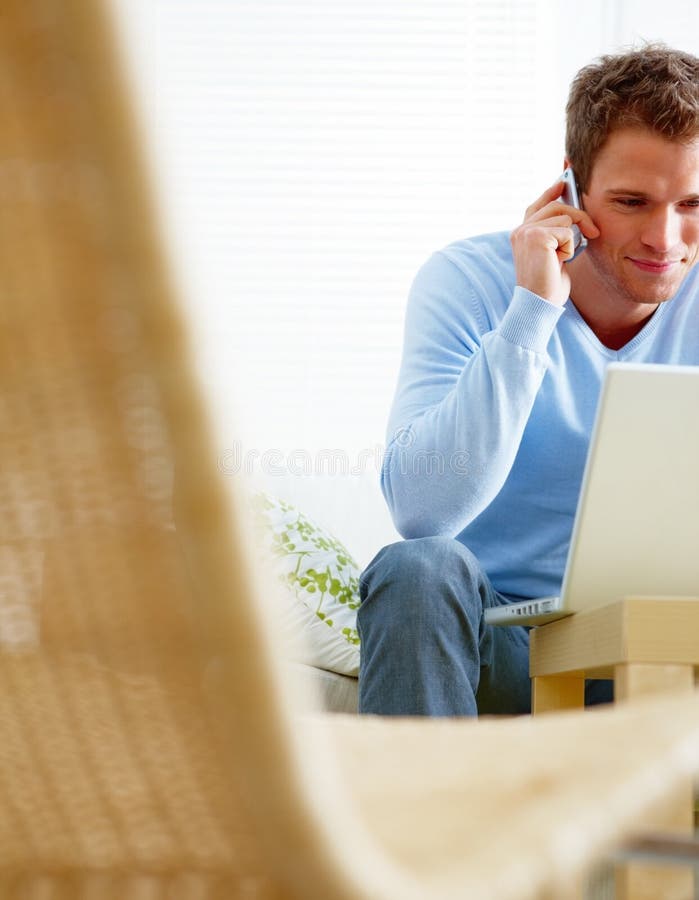 Man Using a Computer Laptop and Mobile Phone Stock Photo - Image of ...