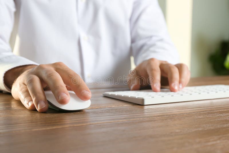 Man Using Computer Mouse and Keyboard at Table Stock Photo - Image of ...