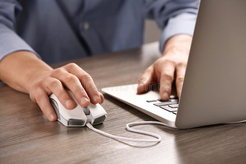 Man Using Computer Mouse with Laptop at Table Stock Photo - Image of ...