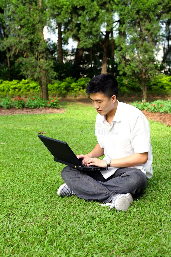 Man using computer outdoor stock photo. Image of blue - 16154246