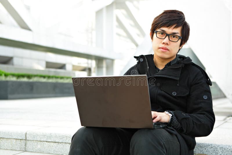 Man using computer outdoor stock image. Image of internet - 18782565