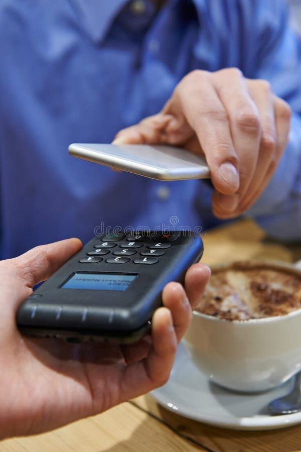 Man Using Contactless Payment App on Mobile Phone in Cafe Stock Image ...