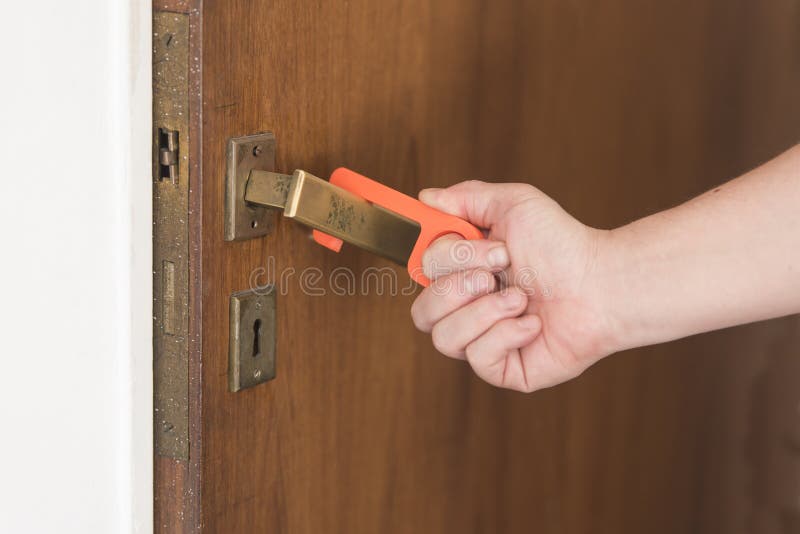 Man Using a Contactless Tool To Open a Door, To Avoid the Spread of the ...