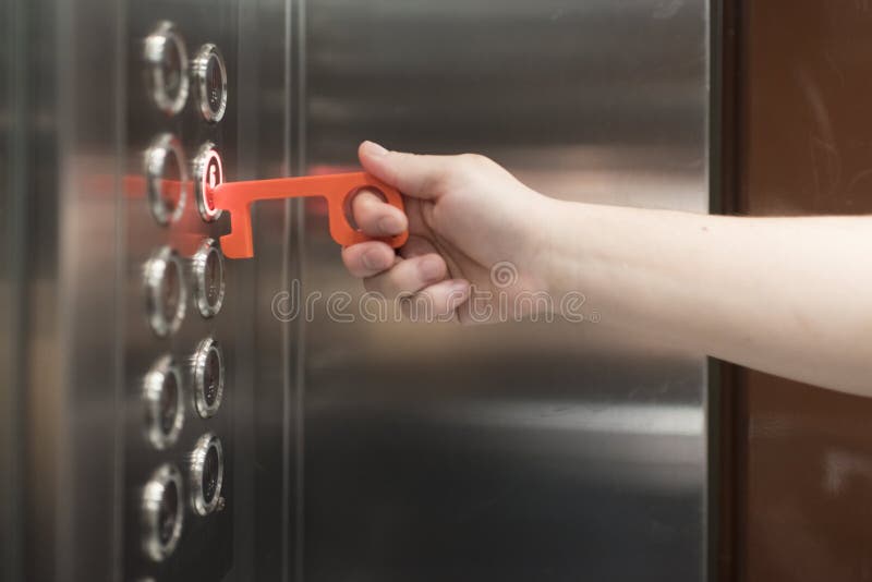 Man Using a Contactless Tool To Press a Button, To Avoid the Covid-19 ...