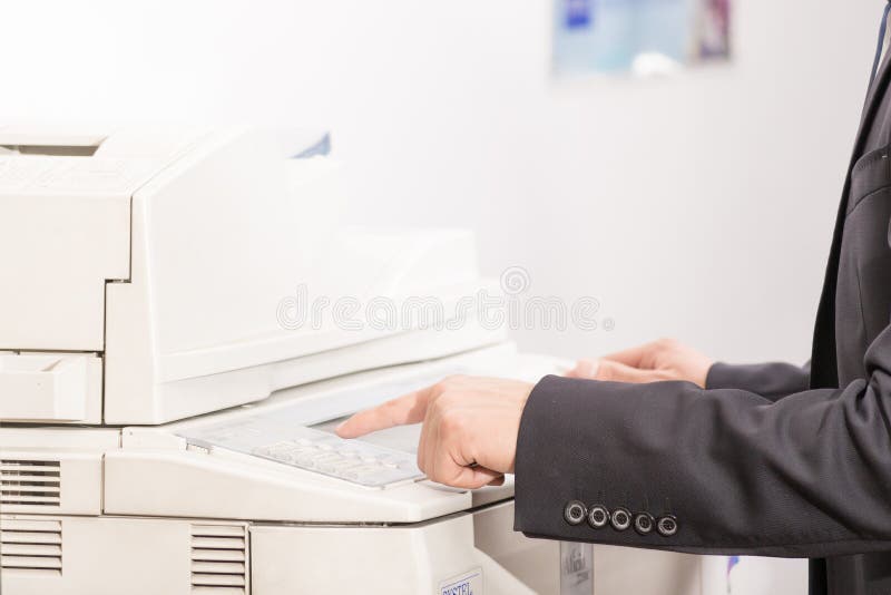 Handsome Young Man Using a Copy Machine Stock Image - Image of button ...