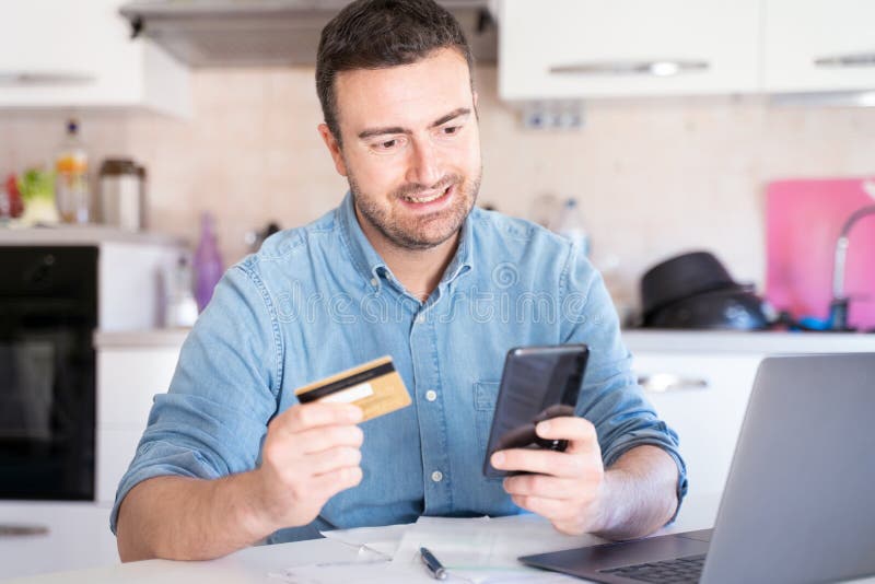 Man Using Credit Card for Online Shopping at Home Stock Image - Image ...
