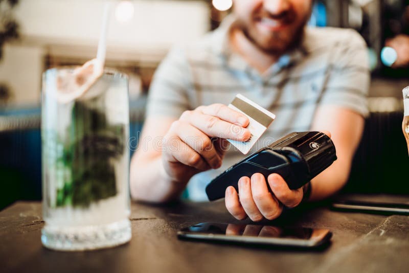 Man Using Credit Card for Paying at Restaurant Stock Photo - Image of ...