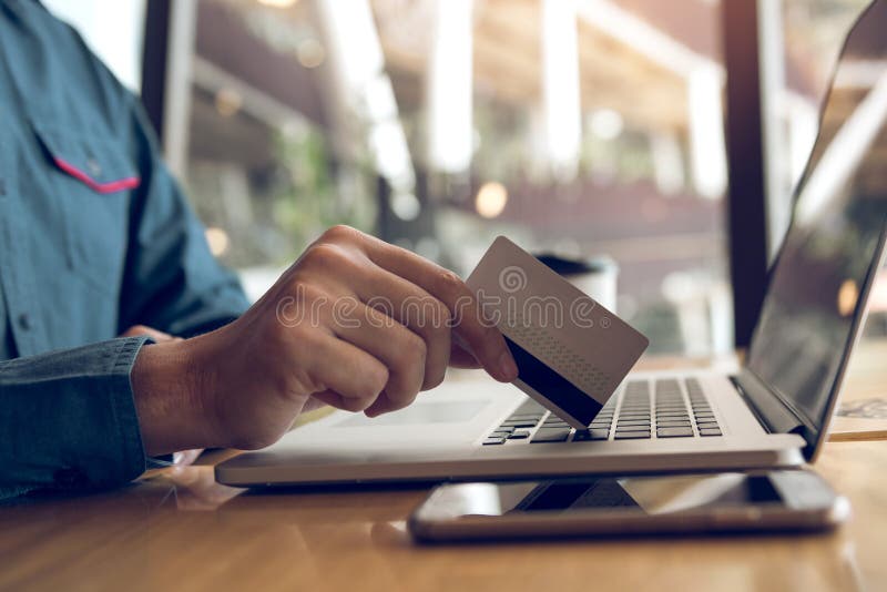 Man Using Credit Card with Shopping Online Concept at Cafe Stock Photo ...