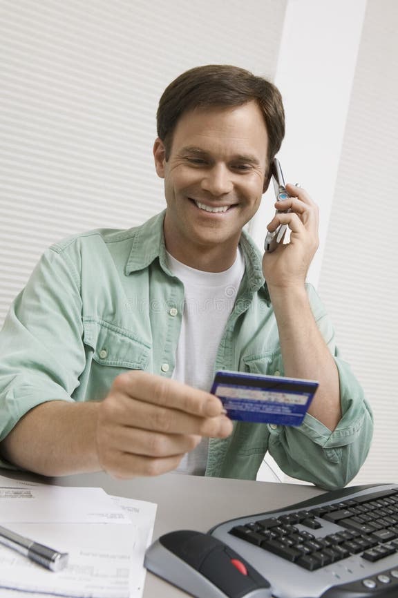 Man Using Credit Card To Order Over Phone Stock Photo - Image of 3035 ...
