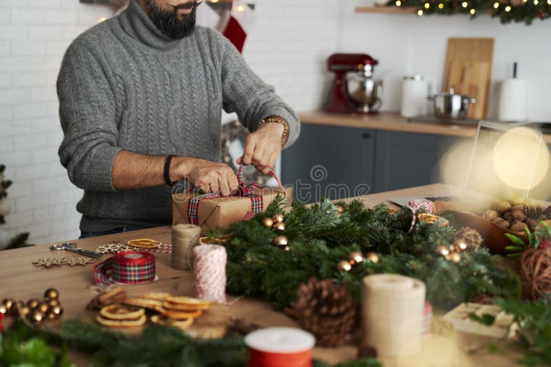 Man Using Decorative Ribbon while Making Christmas Present Stock Photo ...