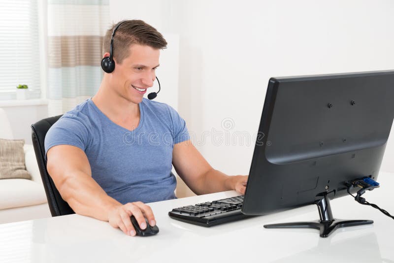 Man with Headset Playing Game on Computer Stock Image - Image of device ...