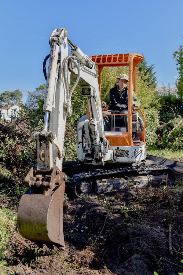 Man using digger in garden stock photo. Image of technology - 101441186
