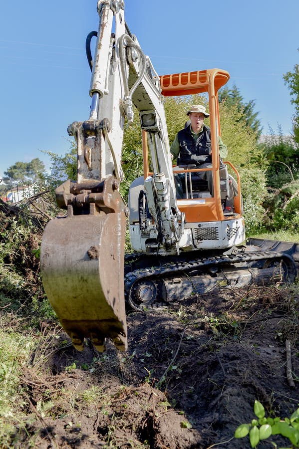 Man using digger in garden stock photo. Image of shovel - 104148622