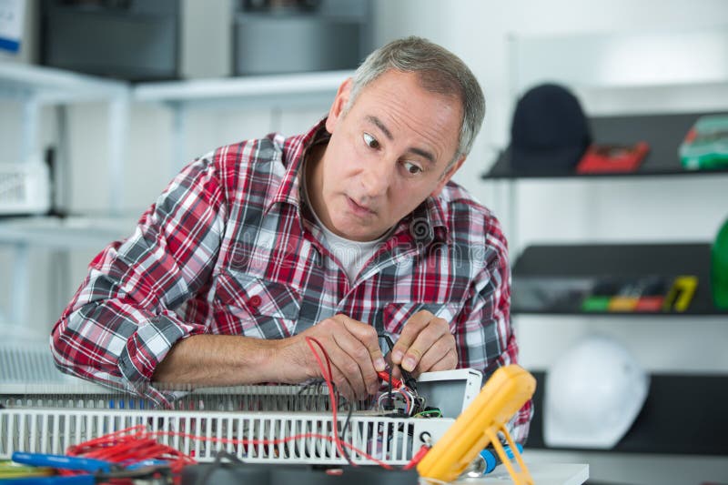 Man Using Digital Multimeter Stock Image - Image of instrument ...