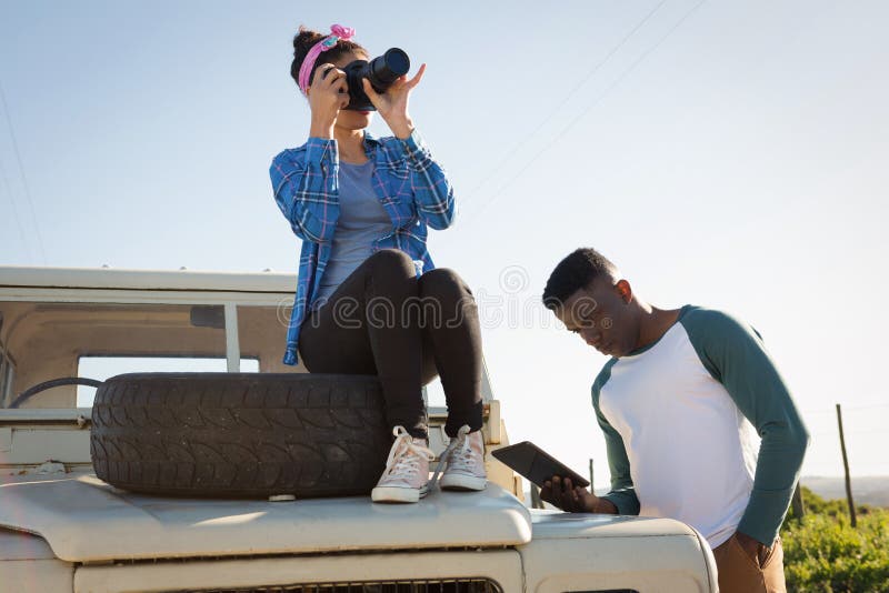 Man Using Digital Tablet while Woman Clicking Picture with Camera Stock ... Man Using Digital Tablet while Woman Clicking Picture with Camera Stock ...