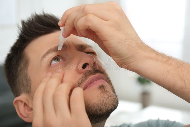 Man Using Drops for Eyes at Home Stock Image - Image of care, dropper ...