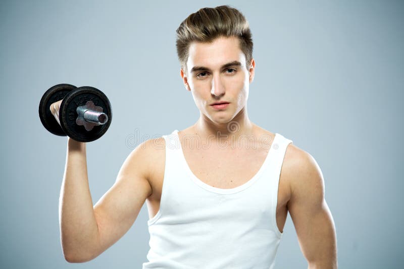 Man using a dumbbell stock photo. Image of power, fitness - 23763172