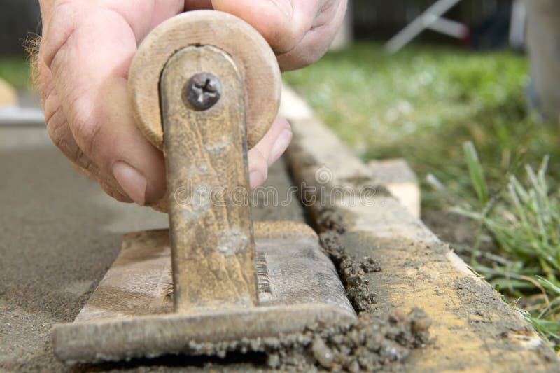 Man Using Edging Tool on Wet Cement Slab Close Up Stock Photo - Image ...