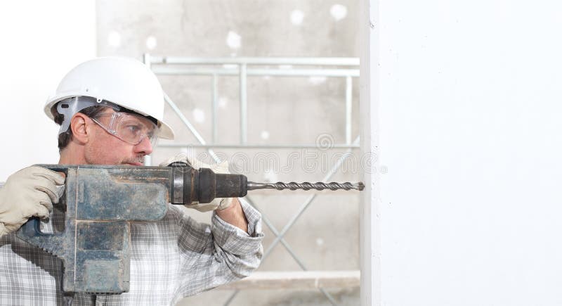 Man Using an Electric Pneumatic Drill Making a Hole in Wall ...