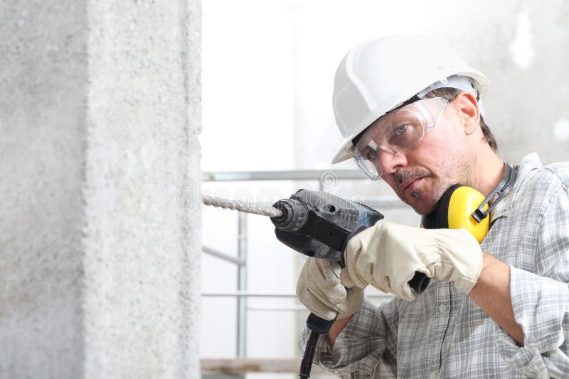 Man Using an Electric Pneumatic Drill Making a Hole in Wall ...
