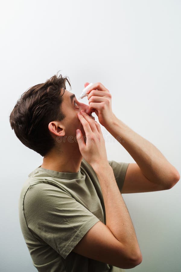 Man is Using Eye Drops for Allergy Treatment. Man Drips Eye with Eyes ...