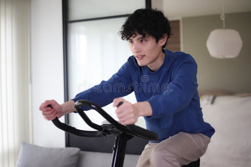 Man Using a Fitness Bike at Home Stock Image - Image of practice ...