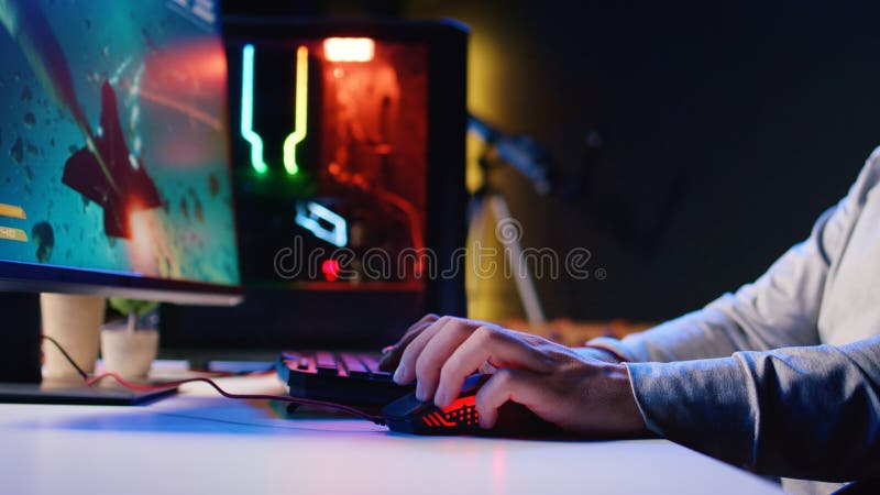 Man Using Gaming RGB Lit Mouse To Shoot Asteroids in Spaceship Flying Videogame Stock Image ...