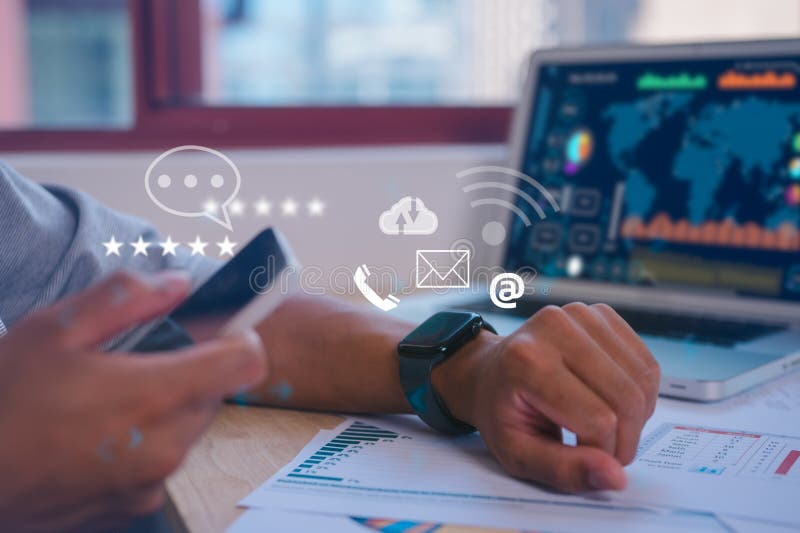 A Man Using a Generic Smartwatch with a Mobile Phone and Computer ...