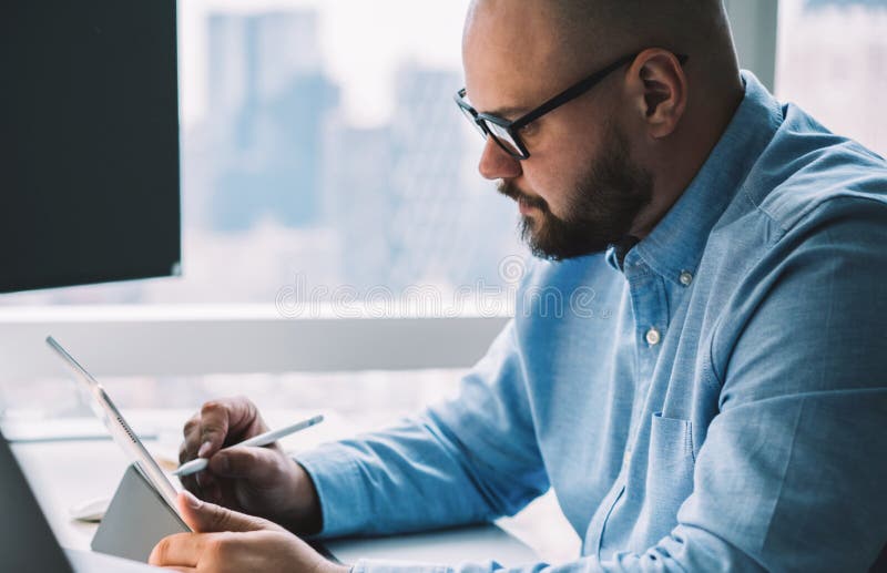 Man Using Graphic Tablet at Desk Stock Photo - Image of drawing, bald ...