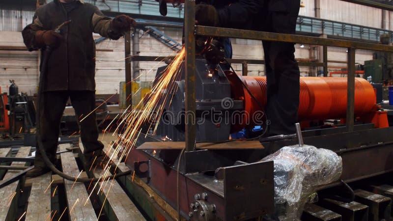 A Man Using a Grinding Machine in the Dark. Grinding the Side of the ...