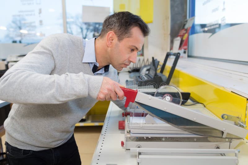 Man Using Guillotine Cutter Stock Photo - Image of handle, cutter ...