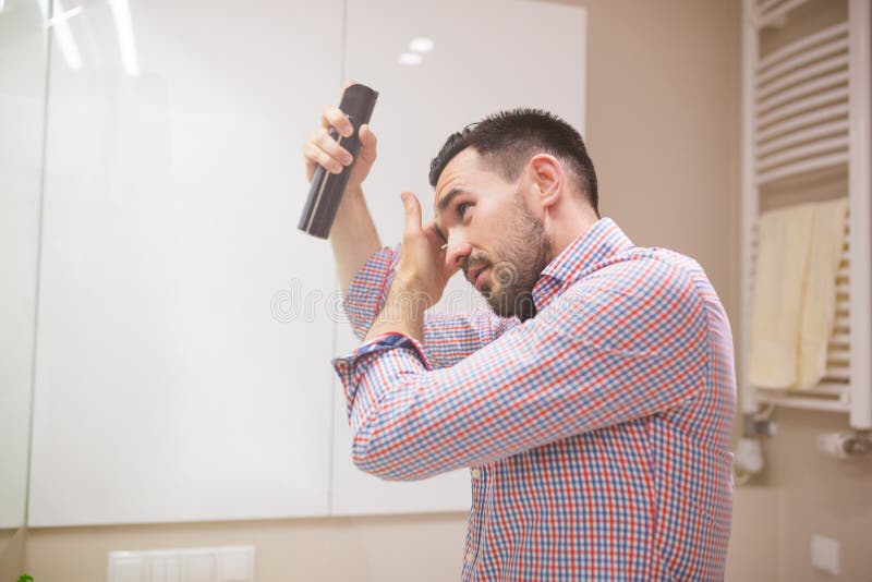 Man using hair spray stock photo. Image of life, care - 66090262