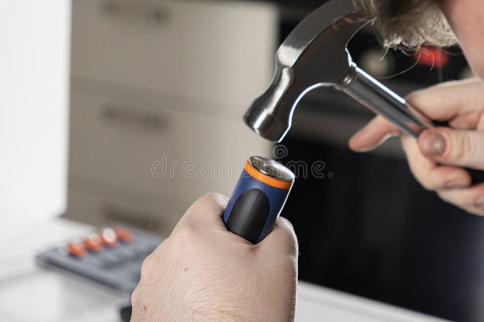 Man Using a Hammer for a Diy Home Repair Project, Close-up on Hands and ...