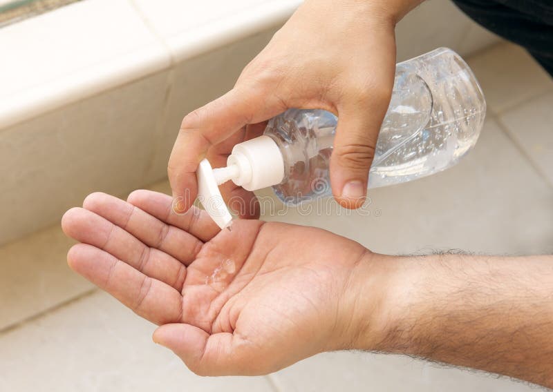 Man Using Hand Sanitizer on His Hands Stock Image - Image of alone ...