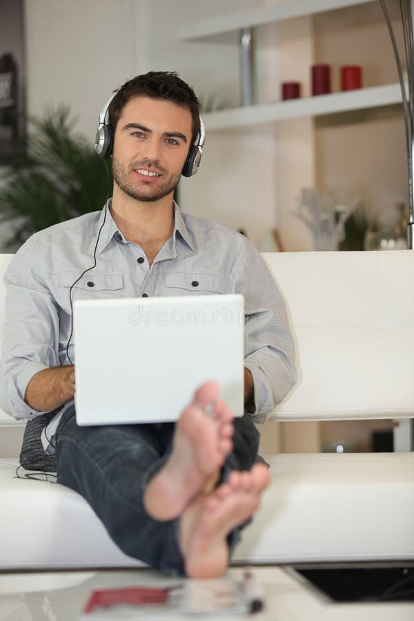 Man using headphones stock photo. Image of download, playlist - 23552616