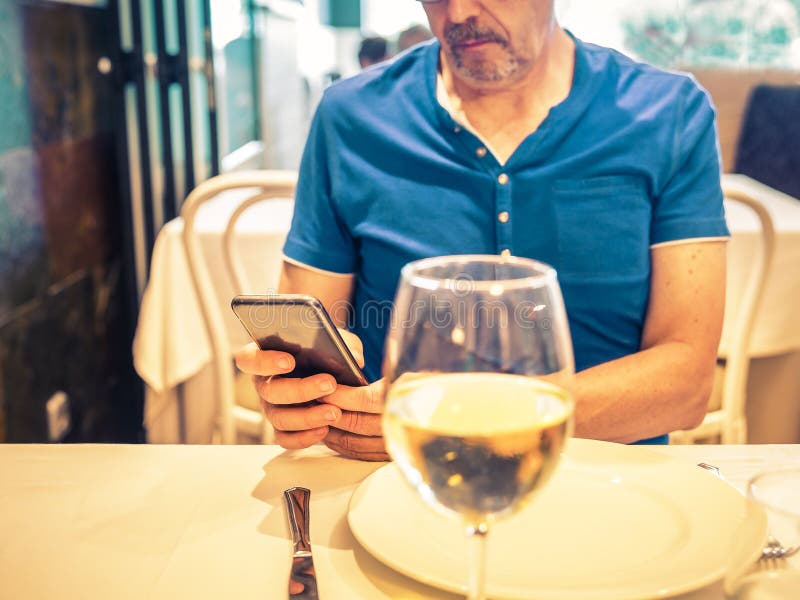 Man Seated Using His Smart Phone Stock Photos - Free & Royalty-Free ...