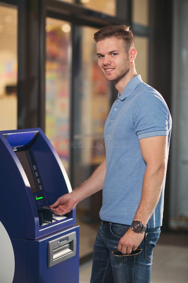 Man Using His Credit Card in an Atm Stock Photo - Image of money ...